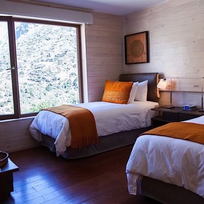 NOI Junior Department twin bedroom at NOI Puma Lodge Hotel