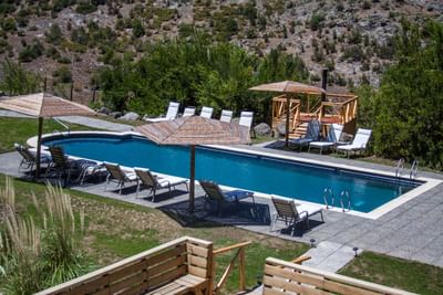 view of outdoor Pool and lounge area at NOI Puma Lodge Hotel