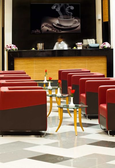 Comfy lounge area in Mina Café at Elaf Bakkah Hotel