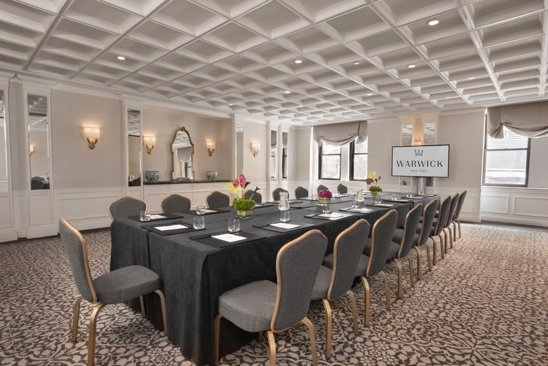 Boardroom table set up with a digital screen in Oxford meeting room at ...