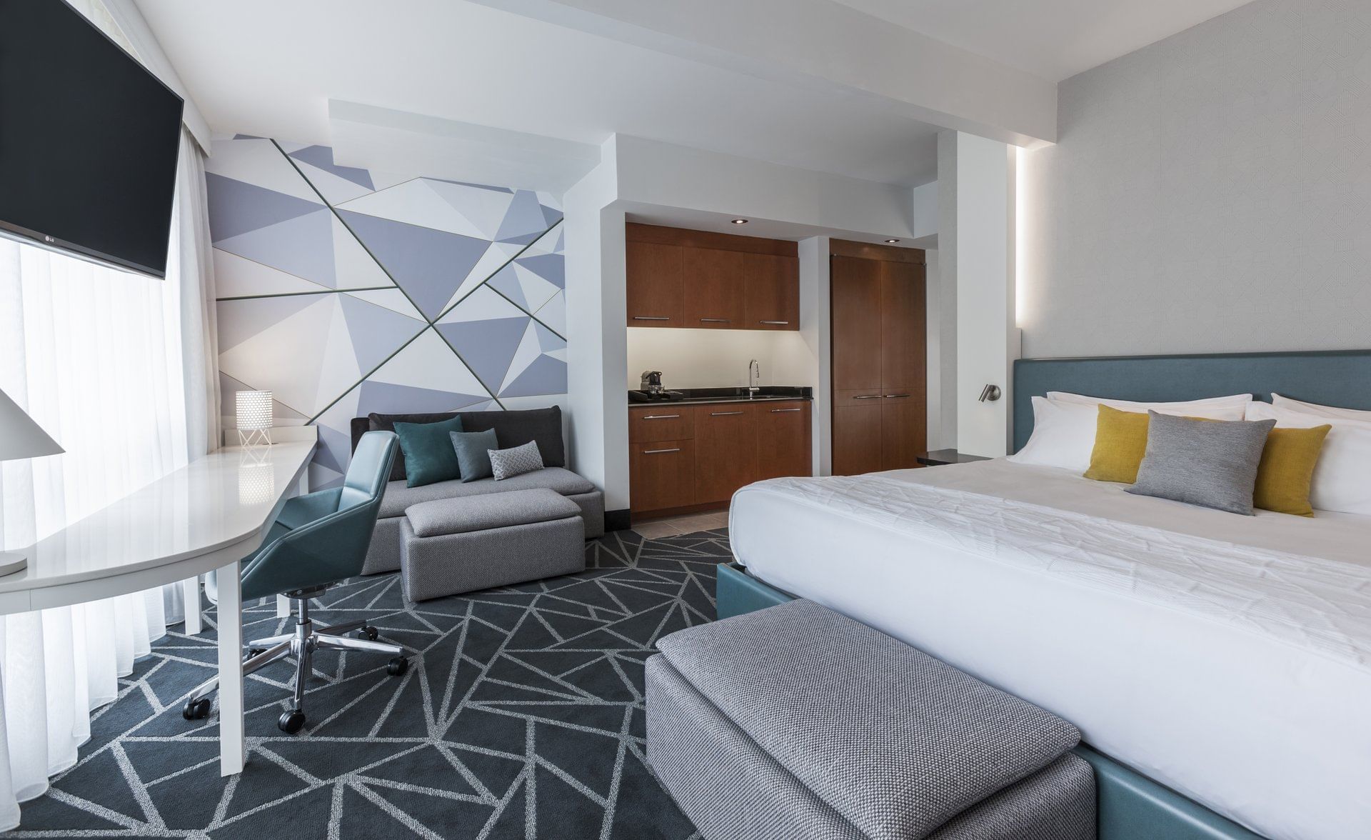 Living & bed area in Loft Suite at Warwick Le Crystal-Montreal